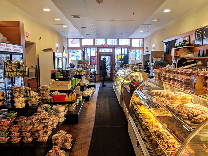 A bakery paradise stretching before you. The display cases filled with cookies and pastries create a gauntlet of temptation impossible to navigate without surrender.