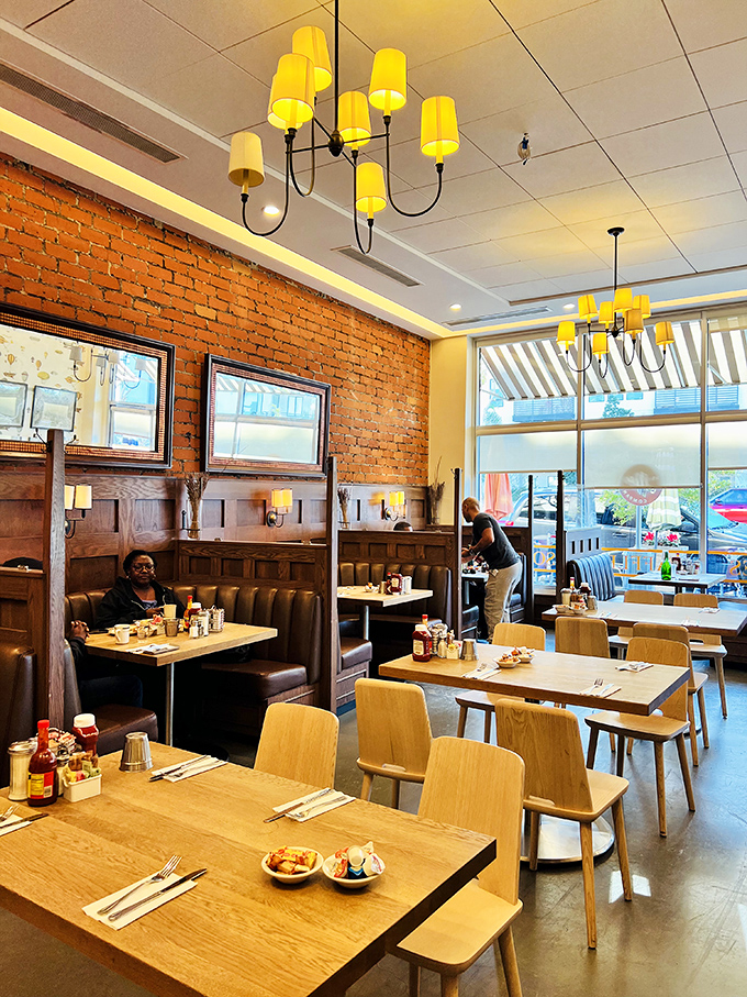 Exposed brick and warm wood create the perfect backdrop for morning conversations that solve the world's problems, one pancake at a time.