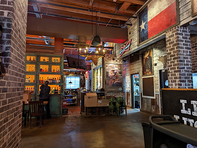 Texas flags, exposed brick, and warm lighting create an atmosphere that says, "Relax, friend&mdash;serious flavor is heading your way."