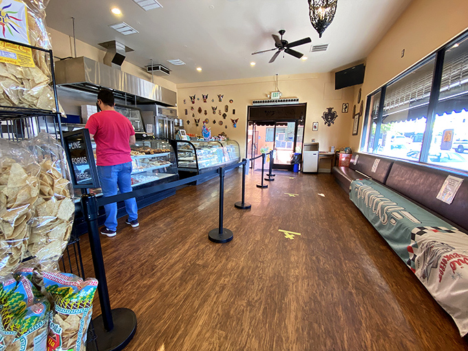 A glimpse inside reveals the efficient ballet of commerce and craft, where glass cases protect treasures more valuable than gold&mdash;fresh-baked pan dulce.