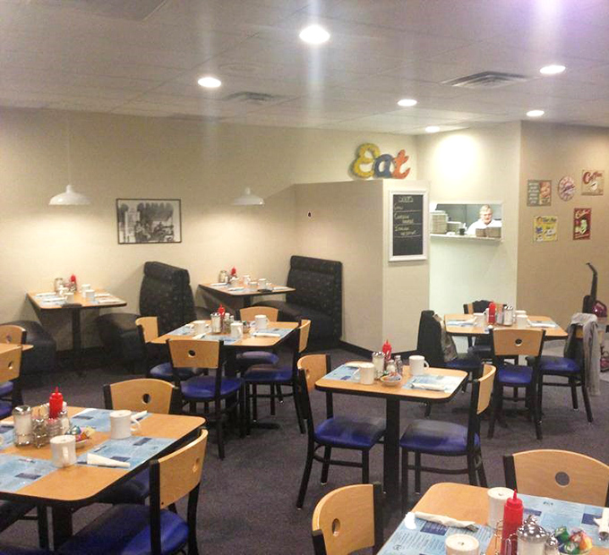 The dining room's quiet corner, where regulars claim their territory. Those ketchup bottles have heard more Toledo secrets than any therapist in town.