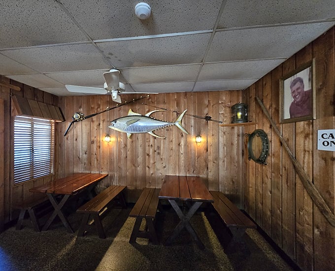 Wood-paneled walls adorned with fishing memorabilia create the perfect atmosphere for serious seafood consumption. It's like dining in a delicious time capsule. 