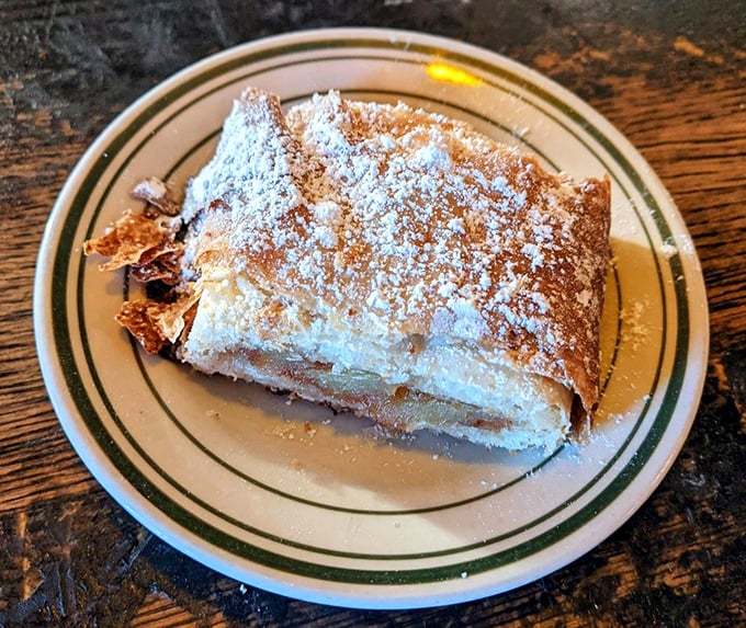 Apple strudel dusted with enough powdered sugar to make it snow in July &ndash; resistance is futile.