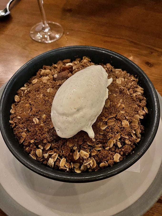 A rustic apple crumble that whispers, "Save room for me." That vanilla bean ice cream slowly melting into warm, spiced goodness is pure theater.
