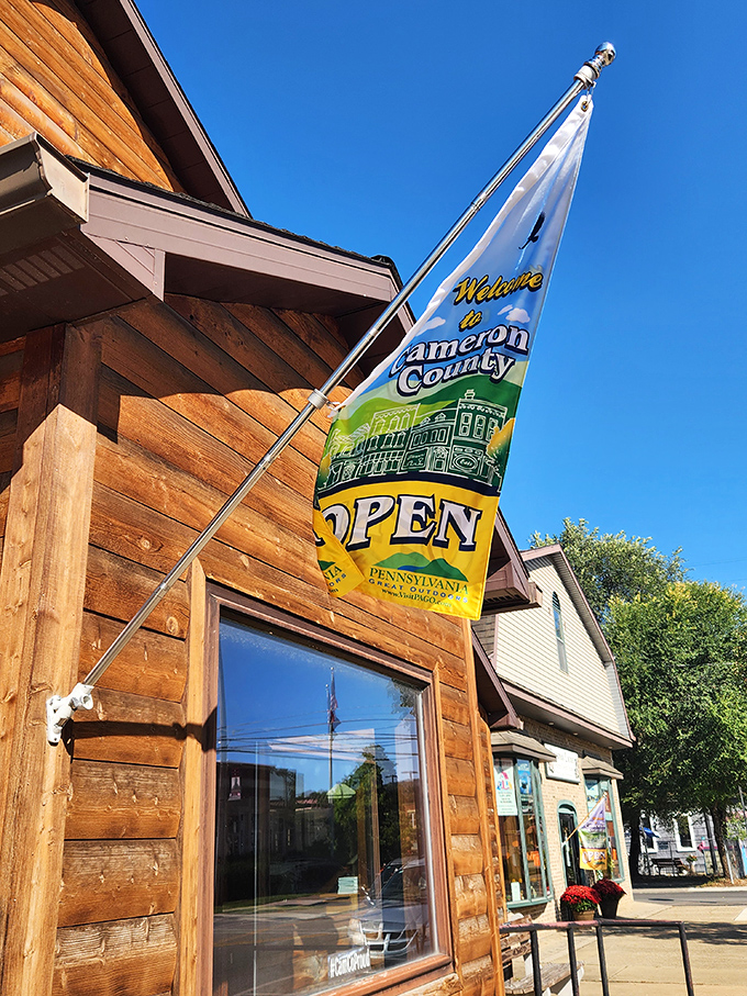 The "Welcome to Cameron County" flag waves like a friendly neighbor, inviting visitors to slow down and discover Pennsylvania's best-kept secret.