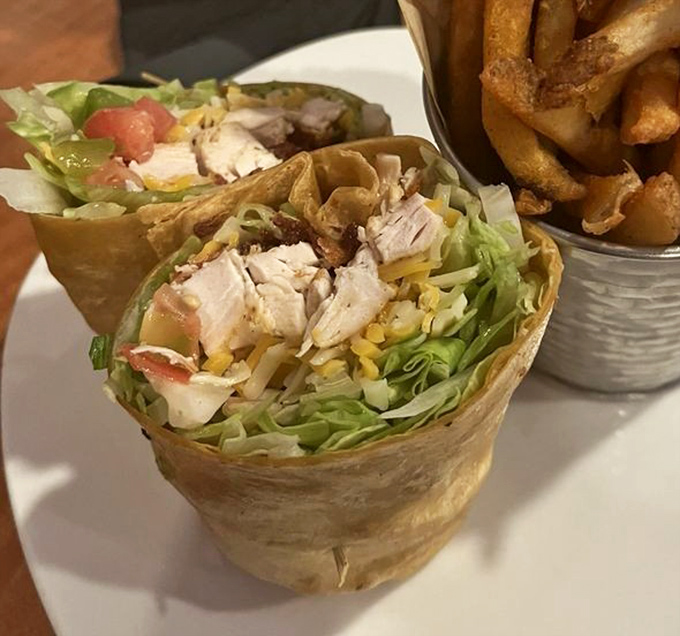 This wrap isn't just stuffed&mdash;it's generously sharing its abundance with the plate. Fresh ingredients playing nicely together in their tortilla home.