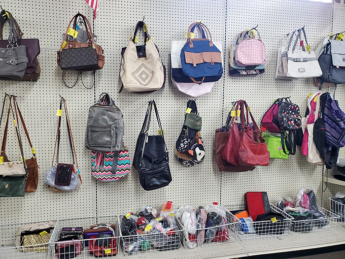 Handbag heaven on pegboard display &ndash; where designer knockoffs mingle with authentic treasures, all waiting for their second act in society.