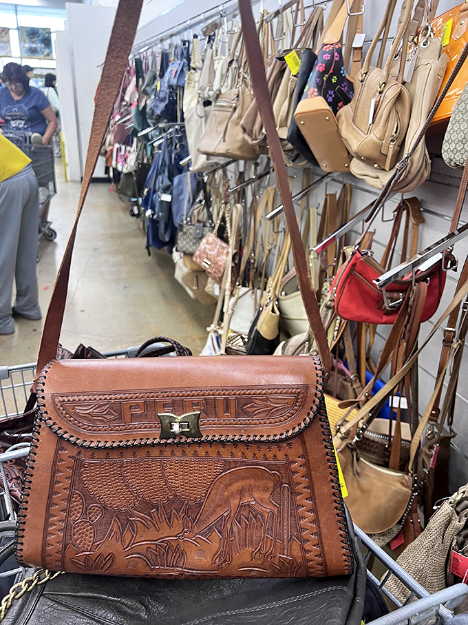 Handbag heaven reveals leather treasures like this intricately carved vintage purse &ndash; a fashion statement waiting to happen.