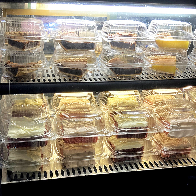 The dessert case: where hope lives after your mouth has been through the hot chicken gauntlet. Sweet salvation awaits behind that glass.