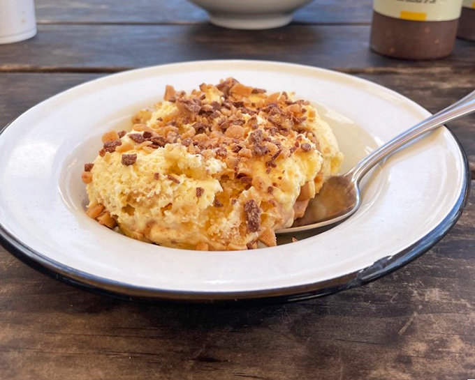 Banana pudding that channels Southern grandmothers everywhere. That crumbled topping is the crown jewel of comfort desserts.