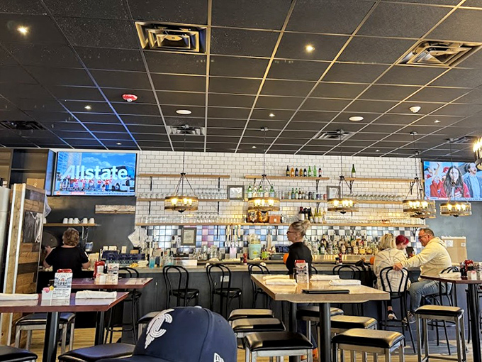 The bar area isn't just functional&mdash;it's where morning meets happy hour. Those golden pendant lights cast the perfect glow for both coffee conversations and evening unwinding.