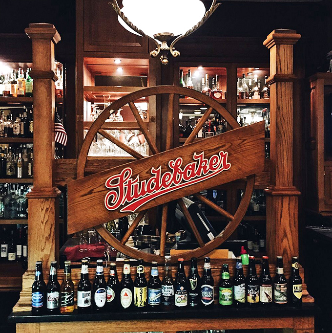 The bar area where Studebaker heritage meets modern hospitality, creating the perfect pre-dinner gathering spot.