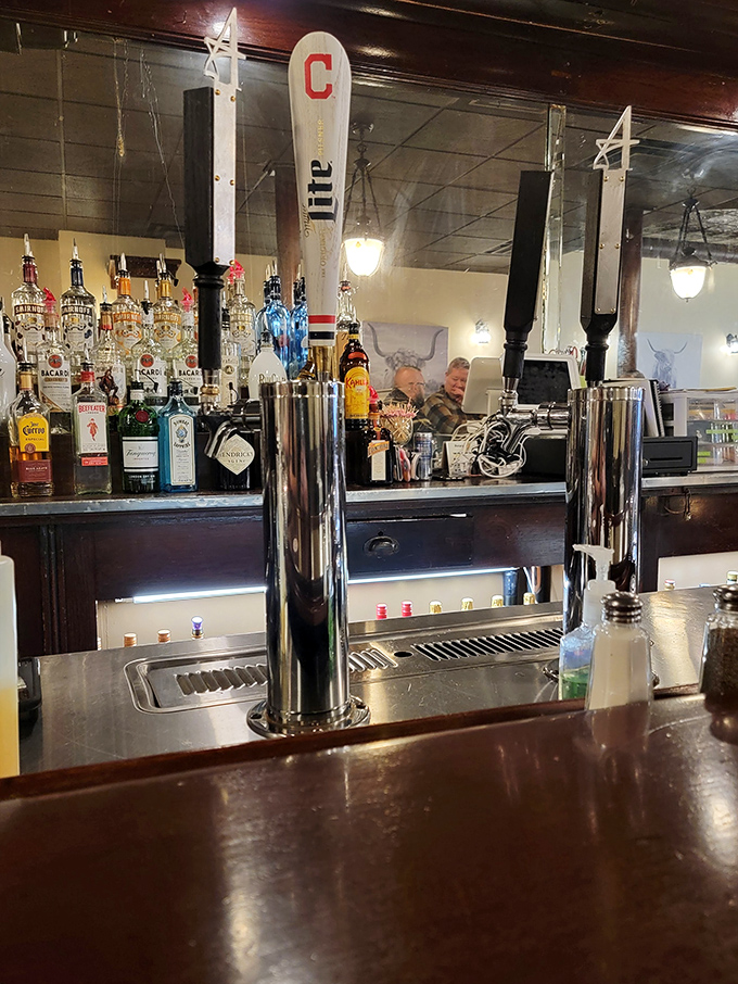A bar setup that means business, complete with Cleveland pride on tap. Those beer handles aren't just dispensing drinks&mdash;they're pouring liquid happiness.