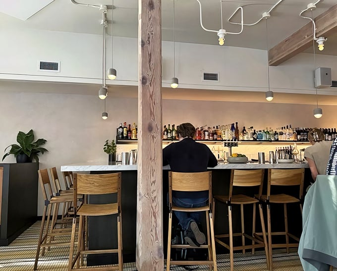 The bar area &ndash; where pizza pairings are pondered and new friendships are formed. Wood, marble, and the promise of a good time.