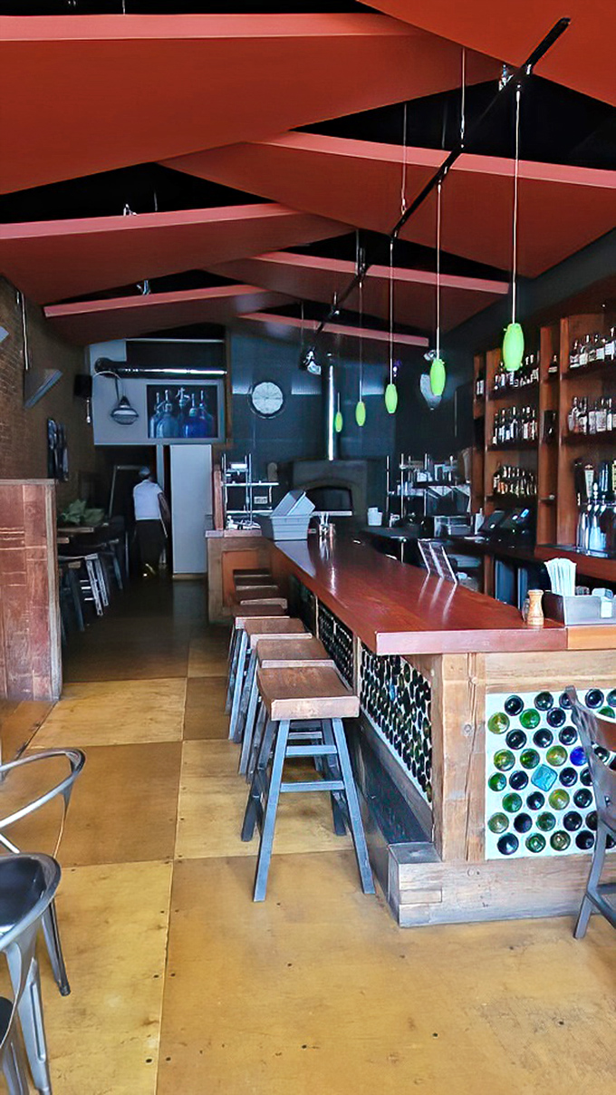 A bar that says, "Stay awhile." Those green pendant lights add just the right touch of whimsy to serious drinking. 