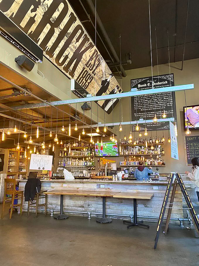 Not just a bar, but a liquid laboratory where cocktail magic happens. High ceilings and pendant lights create the perfect burger cathedral atmosphere.