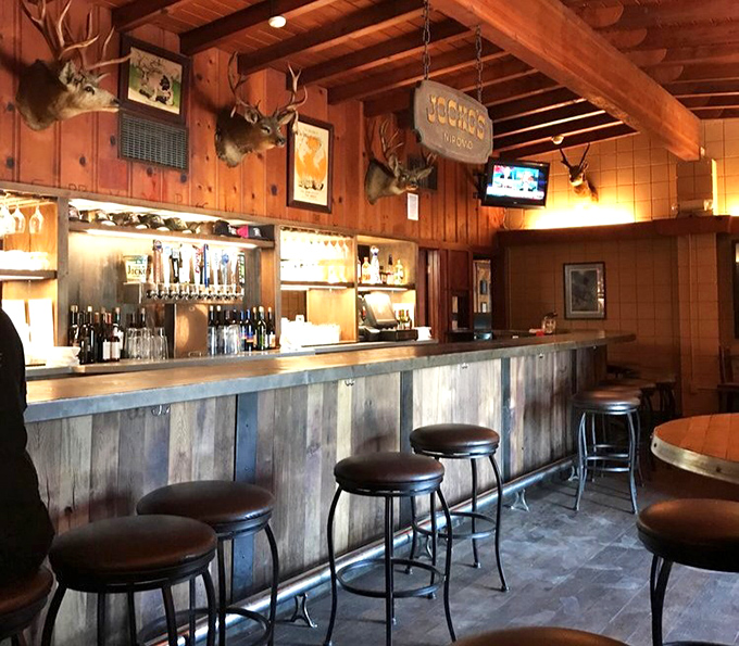 A bar built for conversation, not Instagram posts. Those stools have supported the weight of generations of happy diners waiting for their table.
