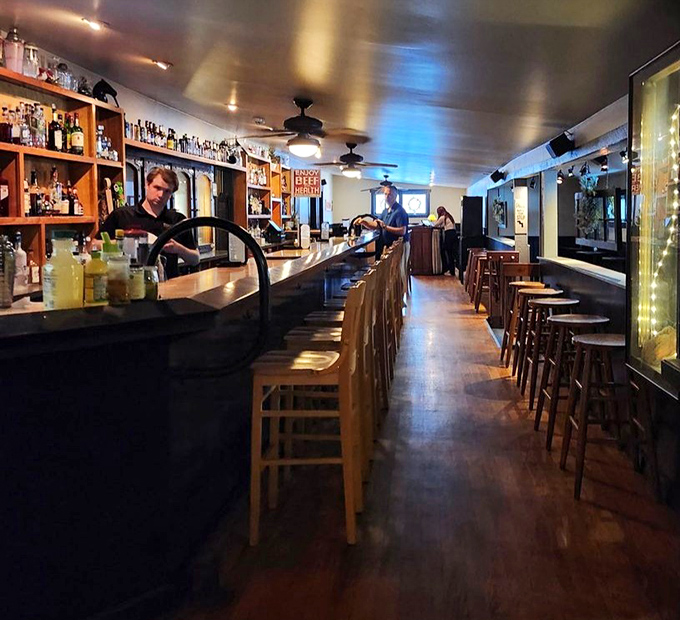 The bar's warm lighting and polished wood create that "one more drink" atmosphere where good evenings become great memories.