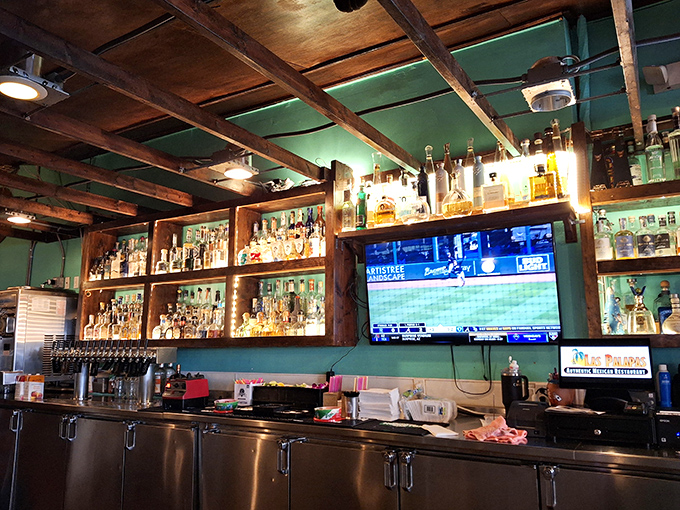 A bar stocked for serious margarita business. With tequila bottles gleaming like liquid gold, this is where Michigan's winter blues come to die.