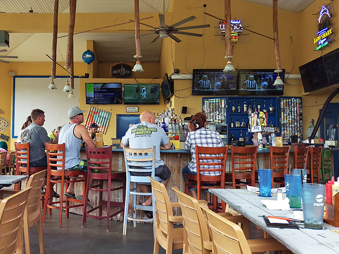 The bar area offers front-row seats to the action. Those fishing-inspired pendant lights remind you that you're never far from water in Cocoa Beach.
