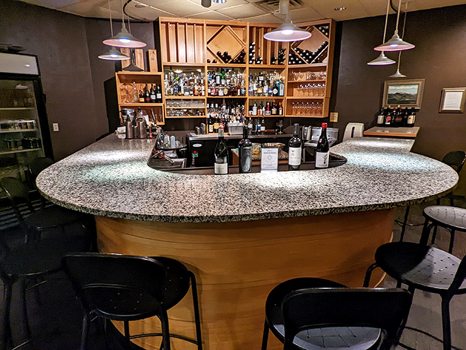 A bar area that invites you to settle in and sample something from those meticulously arranged bottles while contemplating a second dessert.