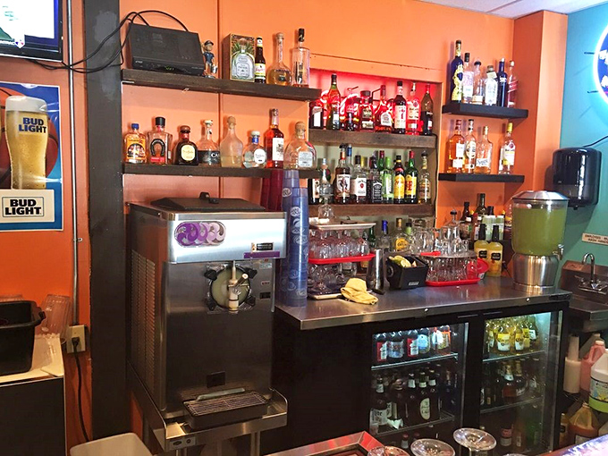 A bar stocked with enough tequila varieties to make you reconsider your "one margarita" promise to yourself.