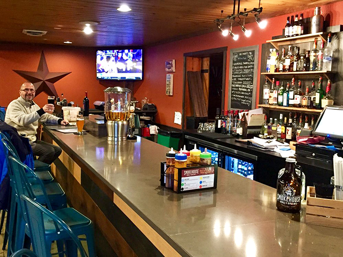 The bar area offers a front-row seat to the liquid side of the menu, where local brews flow and barbecue stories grow taller.