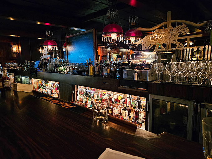 Red lampshades cast a warm glow over one of LA's most impressive liquor collections &ndash; liquid history waiting to be poured.