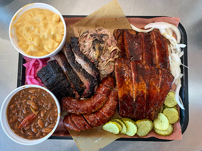 The barbecue platter that makes vegetarians question their life choices. A symphony of smoke, spice, and everything nice on a humble metal tray.