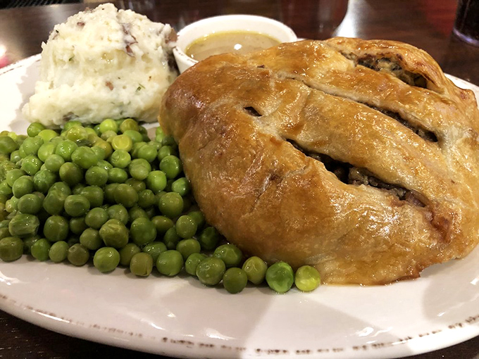 Not all heroes wear capes&mdash;some come wrapped in golden pastry alongside creamy mashed potatoes and vibrant peas. Comfort food, elevated.