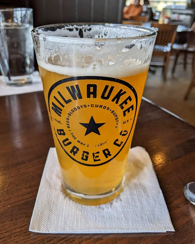 Cold beer waiting patiently to wash down all the cheesy, crispy goodness heading your way.