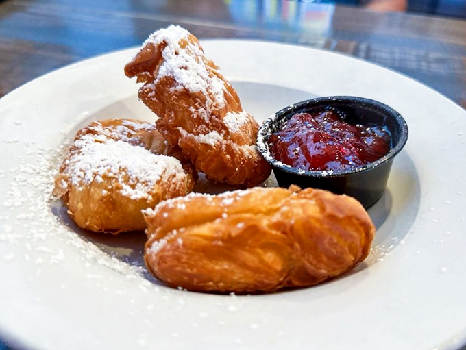 Pillowy beignets dusted with powdered sugar's gentle snow&mdash;New Orleans tradition meets Maryland hospitality on a perfectly simple white plate.