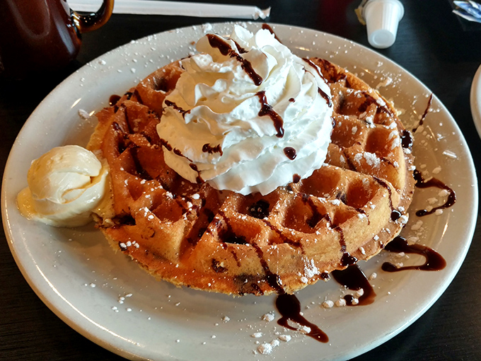 This Belgian waffle topped with whipped cream and chocolate drizzle isn't just breakfast&mdash;it's what birthday cake wishes it could be.