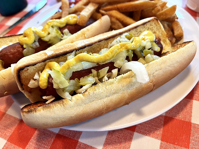 Hot dogs living their best lives under a blanket of toppings. These aren't your ballpark basics—they're backyard cookout royalty on a proper bun.
