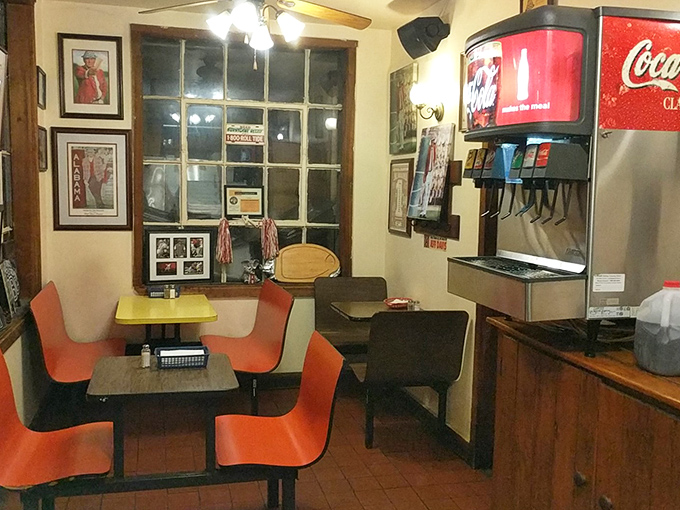 The beverage station and bright orange chairs add pops of color to the no-nonsense interior where the focus remains squarely on the food.