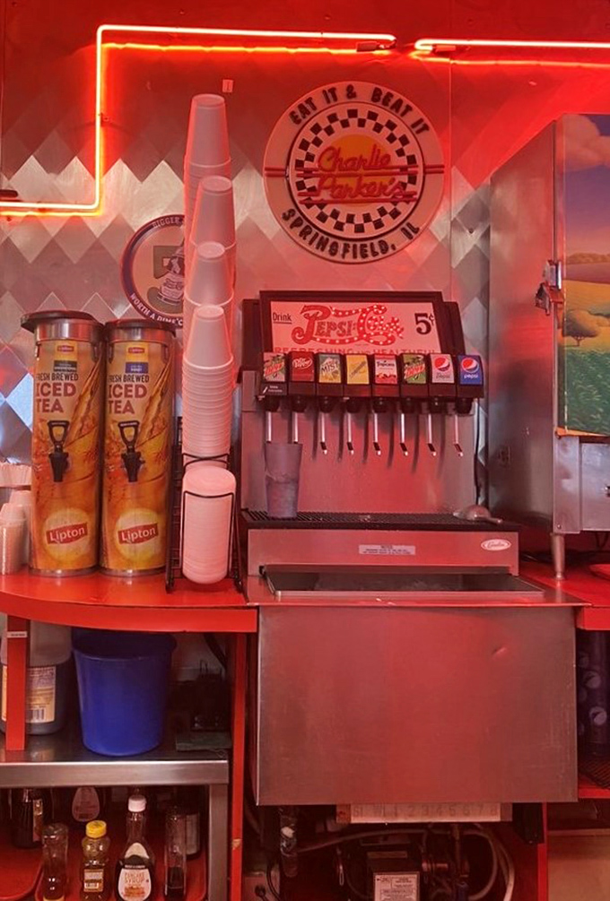 The self-serve beverage station with its classic soda fountain and stacked cups stands ready to quench thirsts with that distinctive mix of nostalgia and practicality.