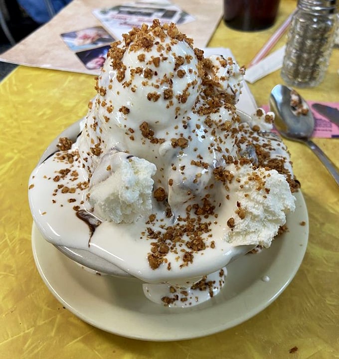 The Everest of ice cream mountains. This vanilla masterpiece with house-roasted nuts demands both respect and a sturdy spoon.