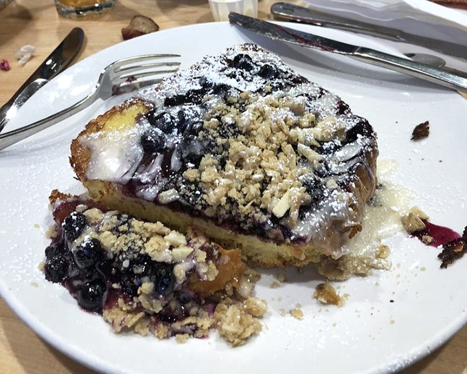 Blueberry French toast that belongs in the breakfast hall of fame. Those berries aren't just fruit&mdash;they're little purple flavor bombs in a landscape of buttery goodness.