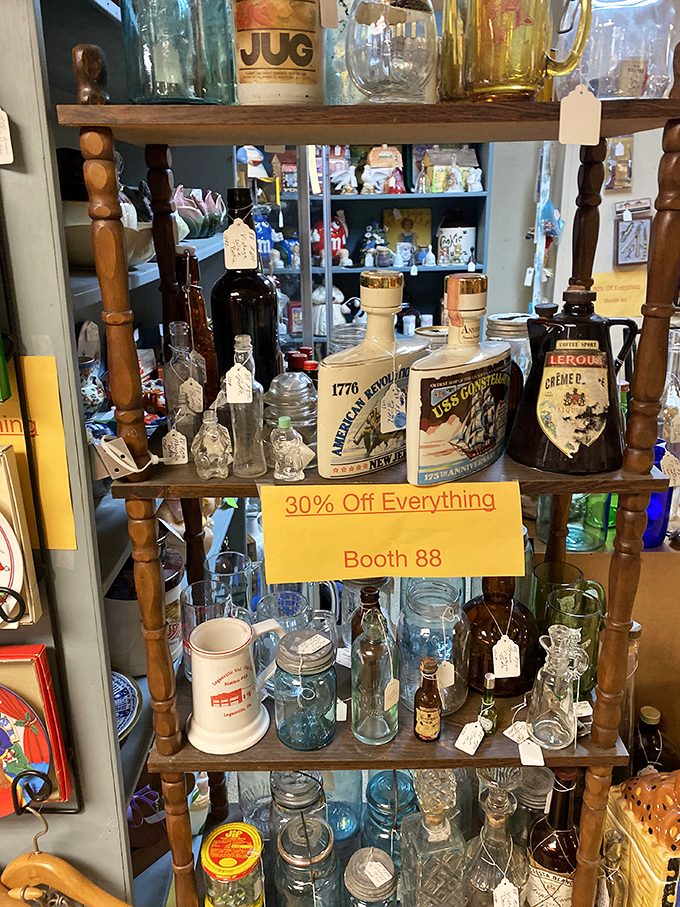 Booth 88's glassware collection sparkles with potential&mdash;each bottle once held something worth preserving, much like the memories they now evoke.