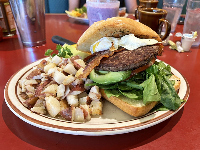 This isn't just a burger&mdash;it's a tower of morning glory with avocado, egg, and those hashbrowns that deserve their own zip code.