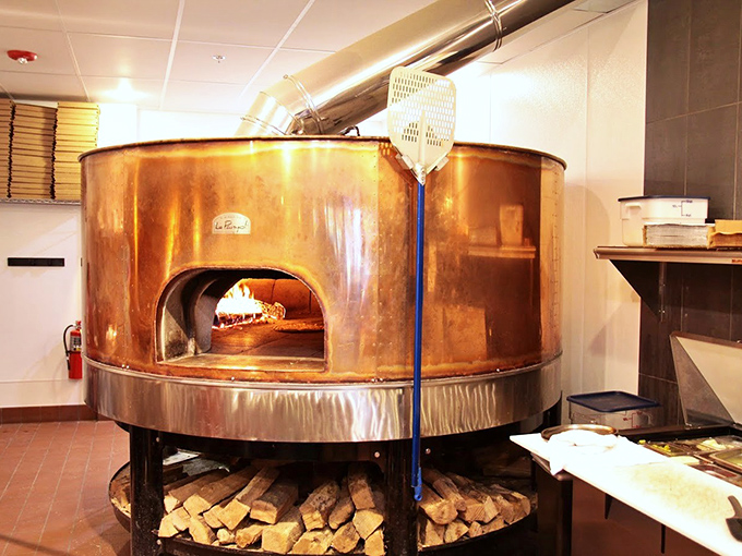 The copper-clad wood-fired oven, glowing with 800-degree intensity, is the heart and soul of Bricks&mdash;a culinary time machine to old-world techniques.