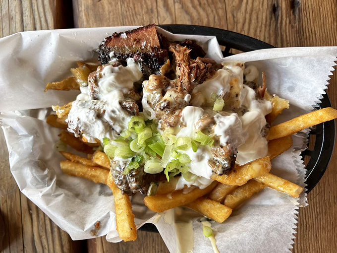 Brisket queso fries&mdash;because sometimes regular fries just won't do. Crispy potatoes smothered in cheese and topped with smoky meat bits and green onions.