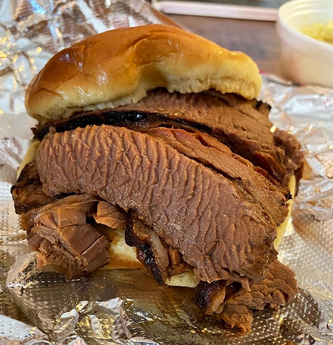 This brisket sandwich isn't just lunch&mdash;it's edible architecture where each layer contributes to the perfect bite-to-bite experience.