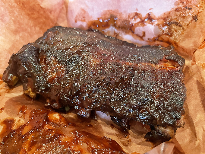 Brisket with a smoke ring so perfect it could make a Texan weep tears of pure, barbecue-scented joy.