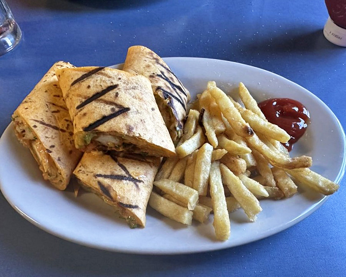 The Buffalo Chicken Wrap brings the heat with cool precision&mdash;grilled tortilla lines containing spicy goodness like flavor bodyguards protecting your taste buds.