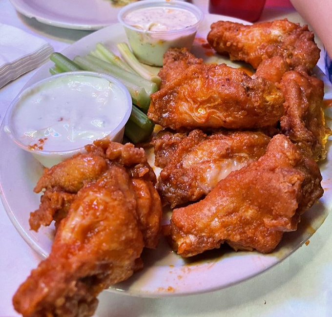 Buffalo wings with the perfect crisp-to-sauce ratio, accompanied by cooling dips and celery sticks&mdash;nature's way of making you feel virtuous while indulging.