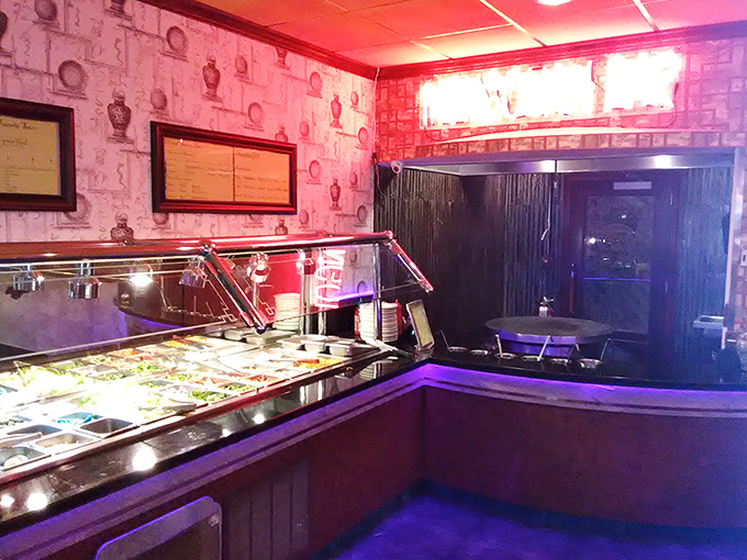 The buffet line awaits, illuminated like a runway of culinary possibilities. Your move, hungry traveler.