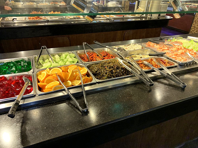 The buffet line—where decisions matter and strategy is everything. Those orange slices offer a refreshing palate cleanser between savory adventures.