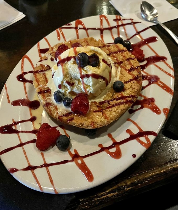 Dessert that demands a moment of silence &ndash; warm butter cake crowned with ice cream and berries in a presentation that's both elegant and playful.