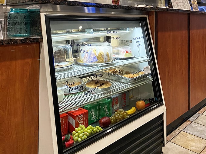 A tempting dessert display case featuring homemade sweets that beckon like sirens calling sailors to shore.